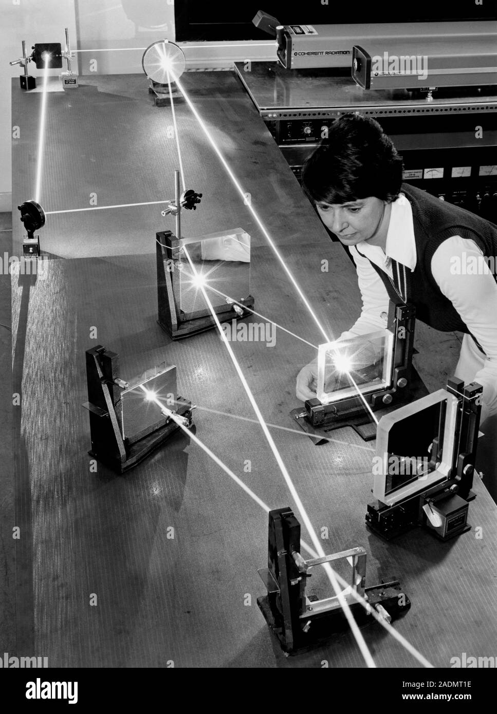 Technician producing interference gratings. Here, a laser beam is being ...