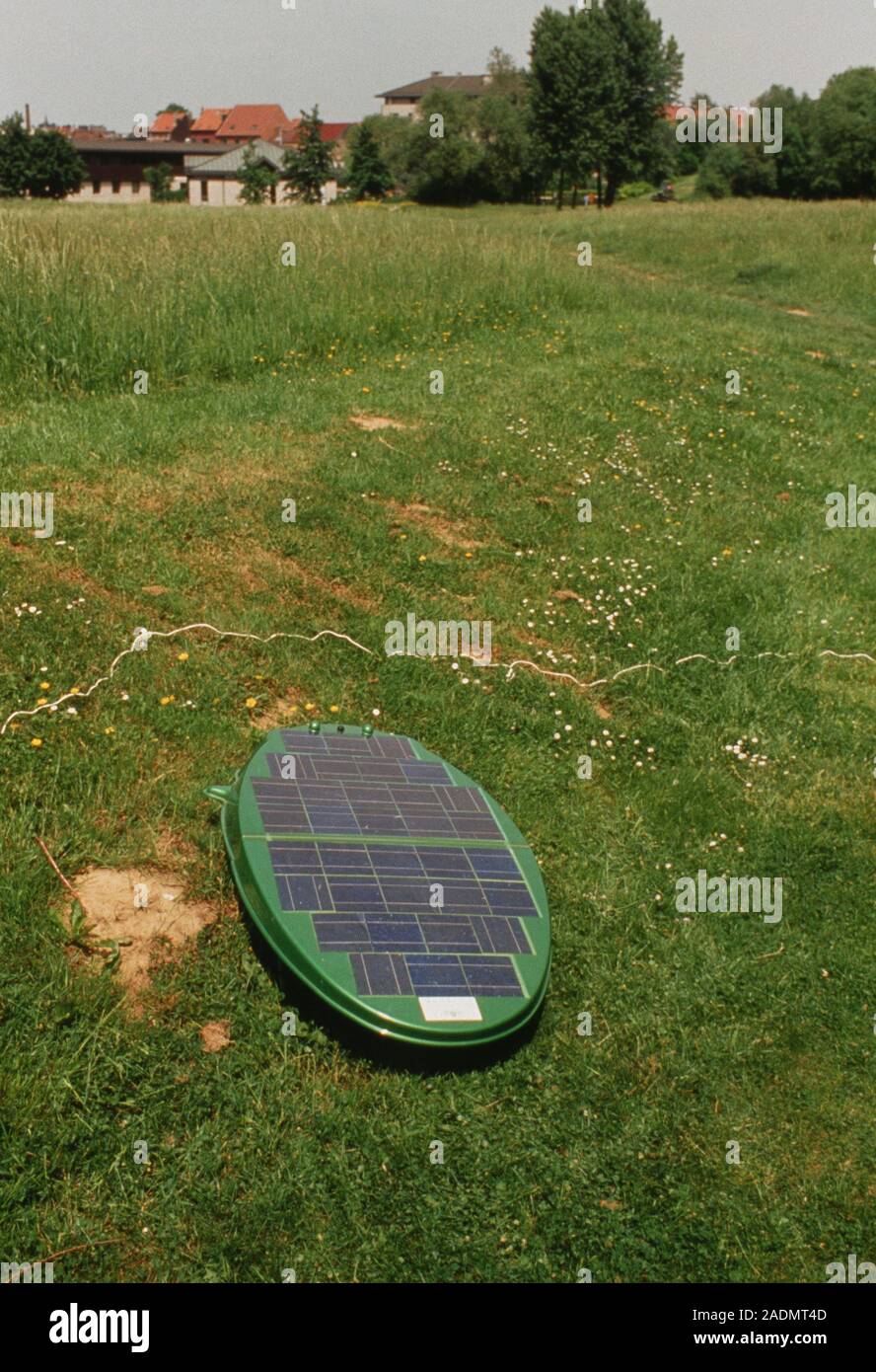 Robot lawnmower. View of a solar powered robot lawnmower in action ...