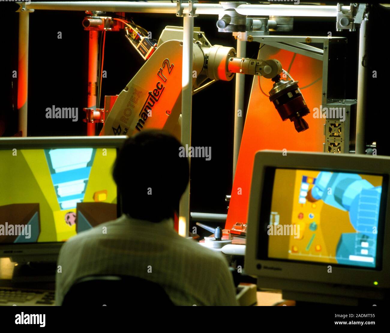 Robotics experiment. View of a technician working with the ROTEX robot ...