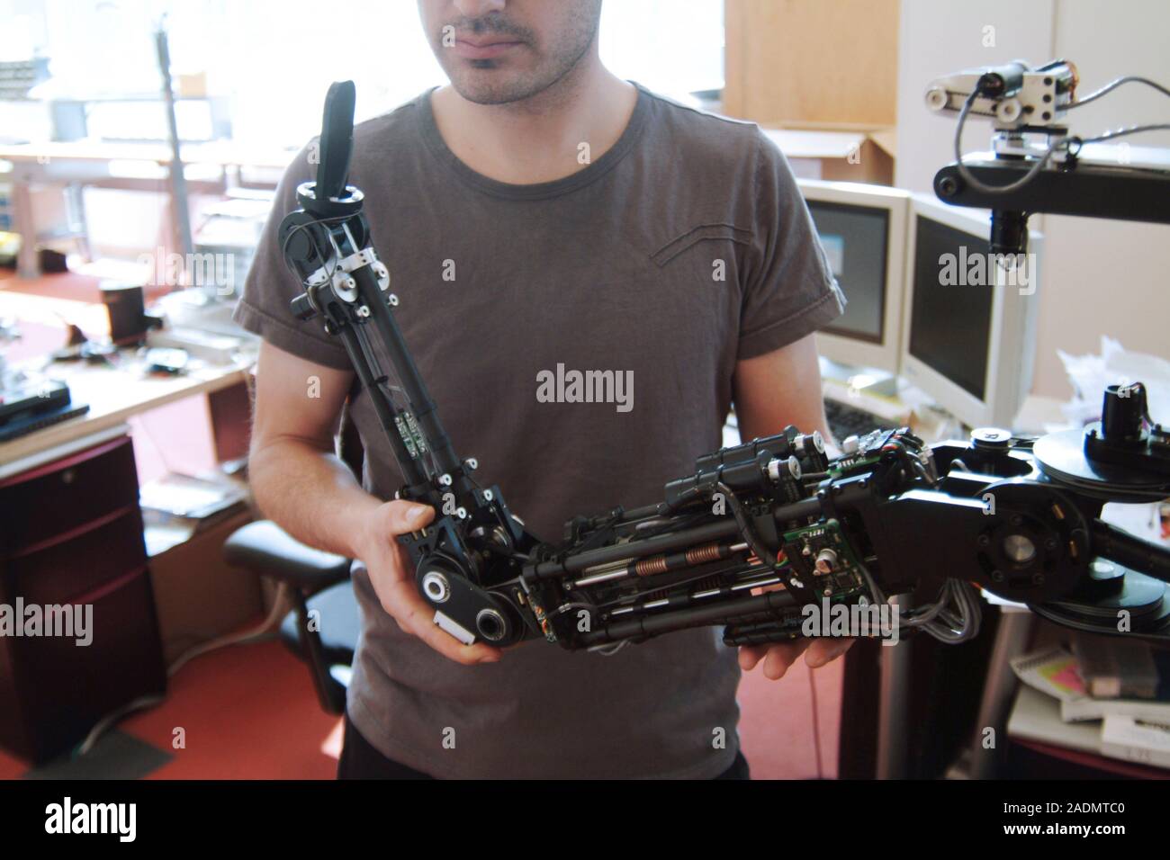 Robotics research. Student working with a robot at the Massachusetts ...