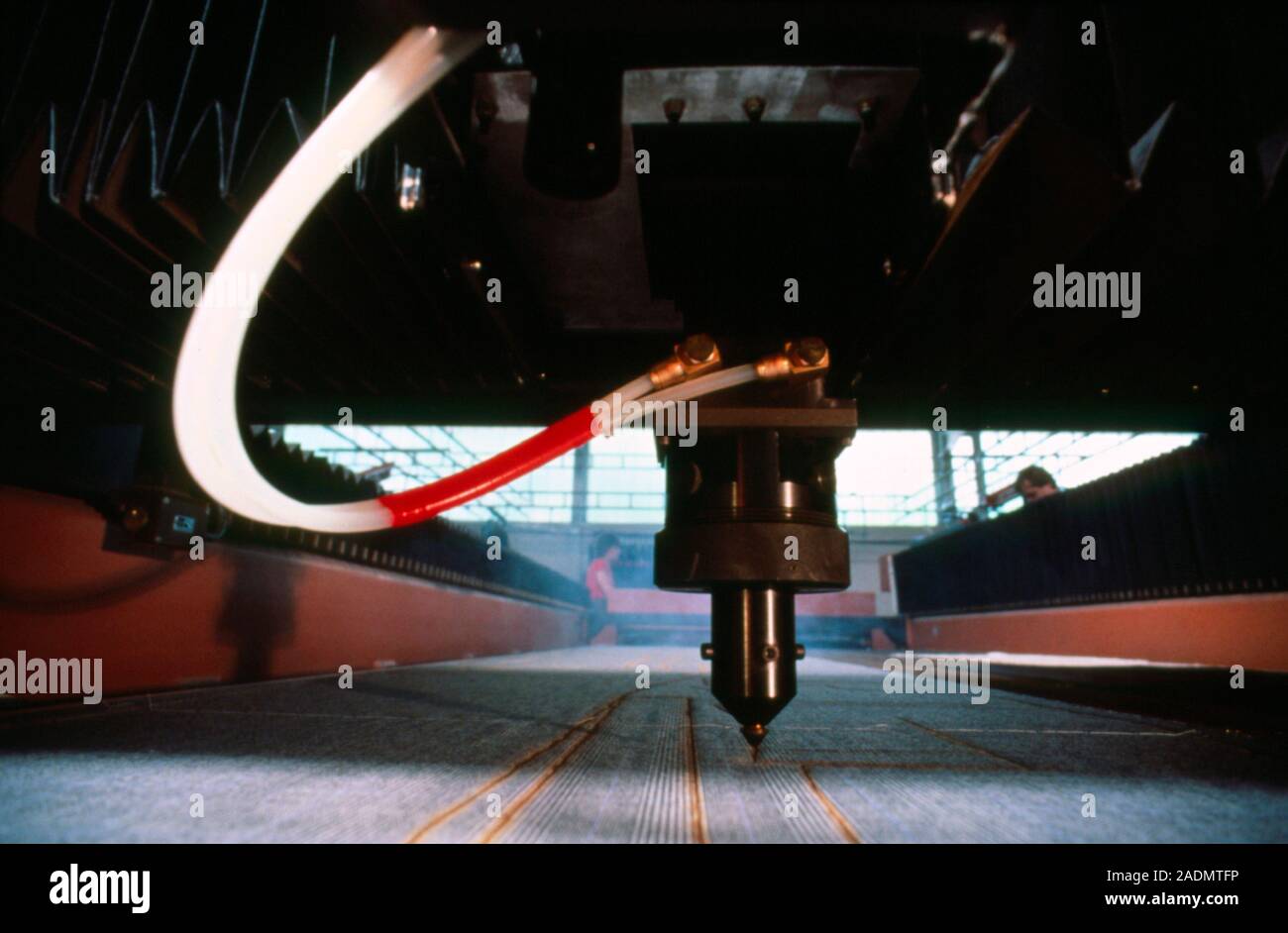 Laser scissors: robot carrying laser cutting device used to cut fabric ...
