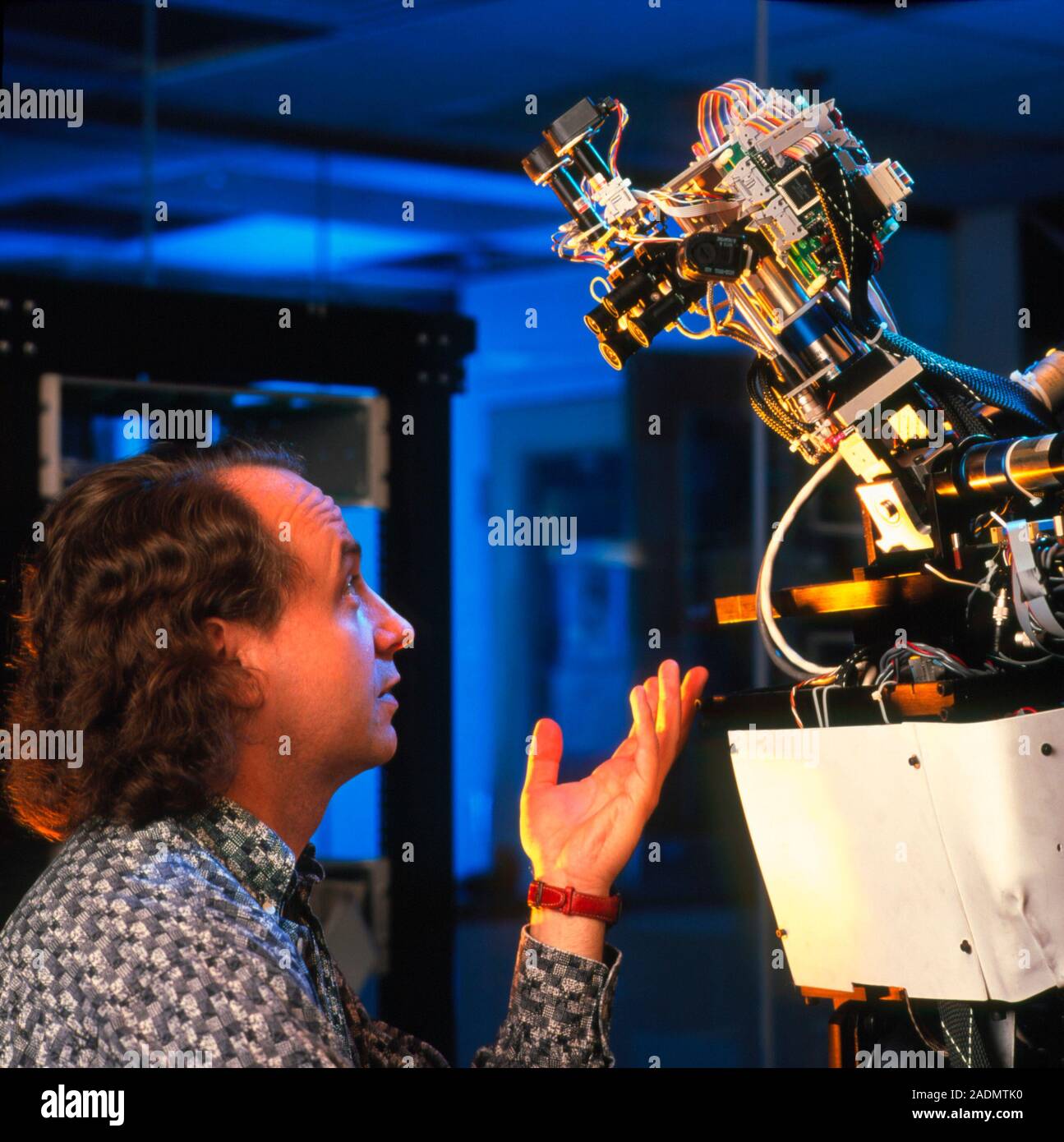 Android robot. Researcher Rodney Brooks with Cog", an android robot he ...