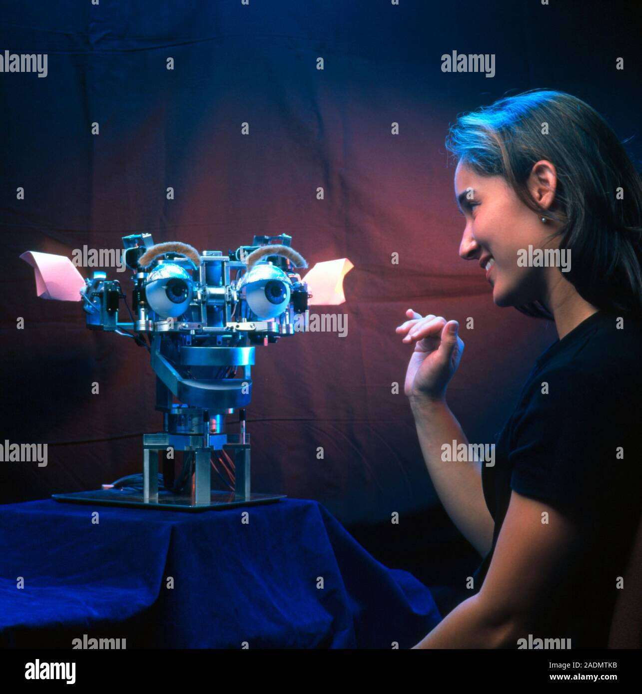 Kismet robot. Researcher Cynthia Breazeal interacting with Kismet, a ...