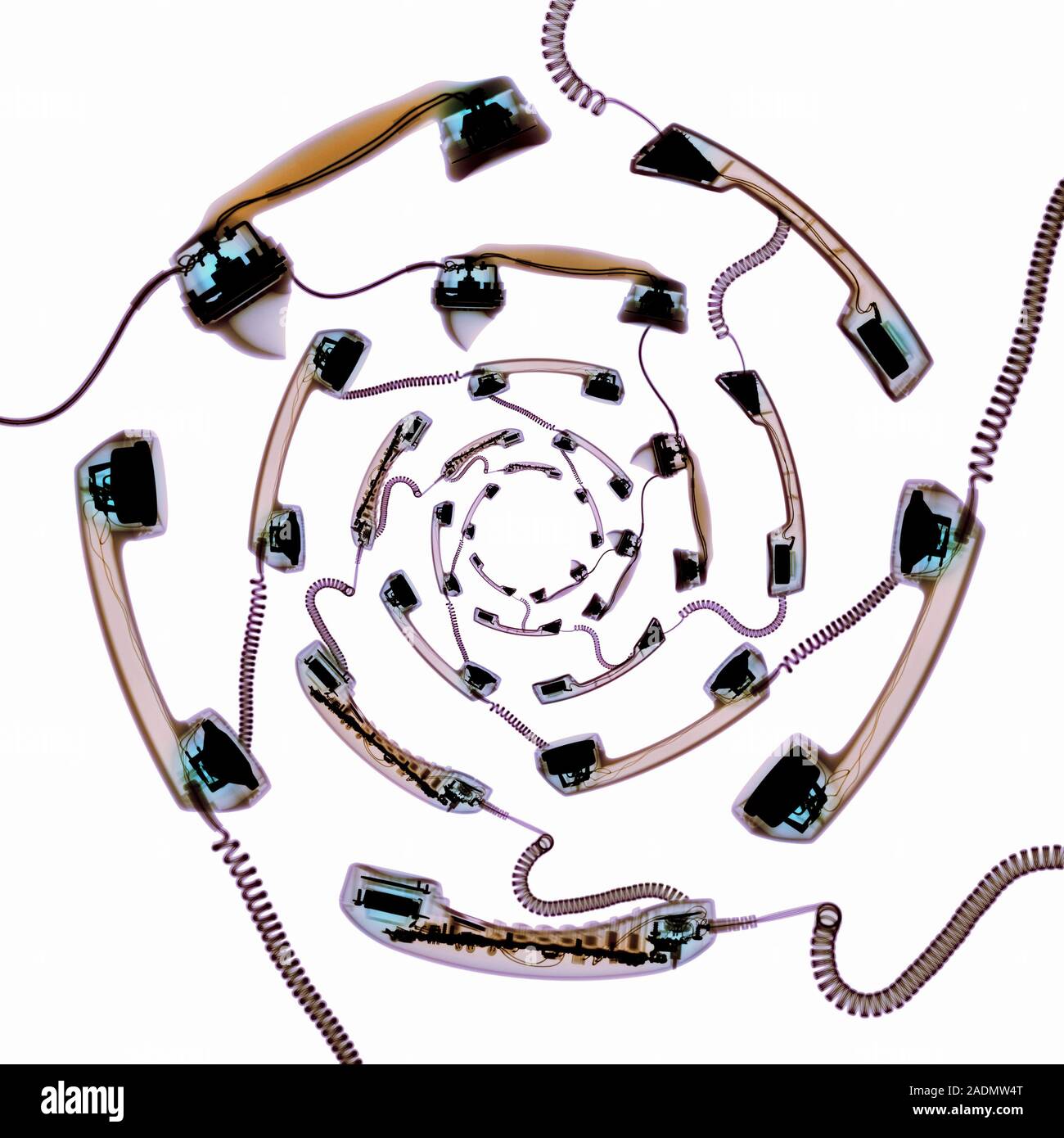 Networking. Conceptual coloured X-ray of telephone handsets arranged in ...