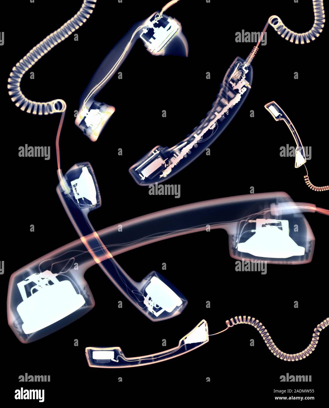 Telephones. Coloured X-ray of telephone handsets Stock Photo - Alamy