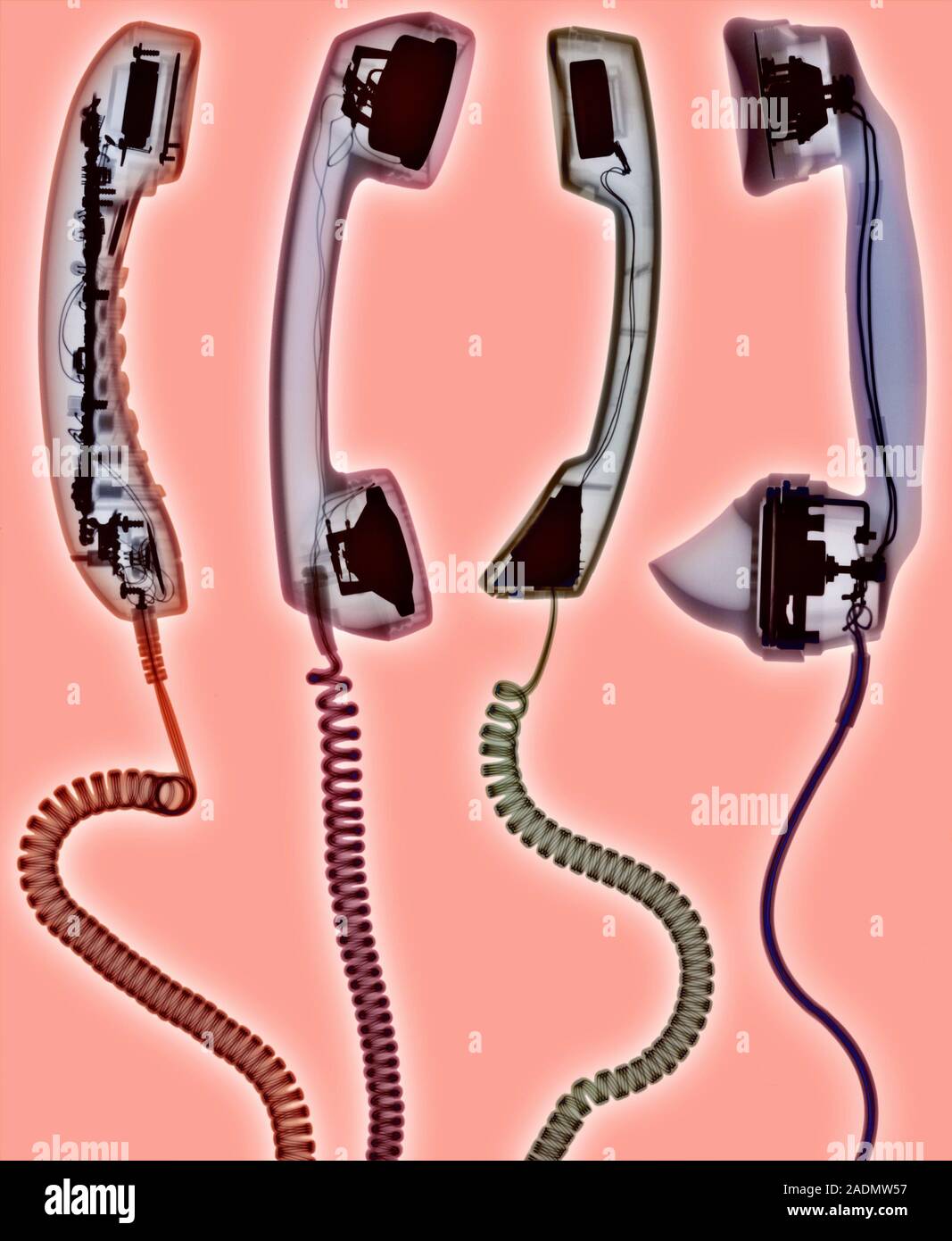 Conference call. Conceptual coloured X-ray of telephone handsets ...