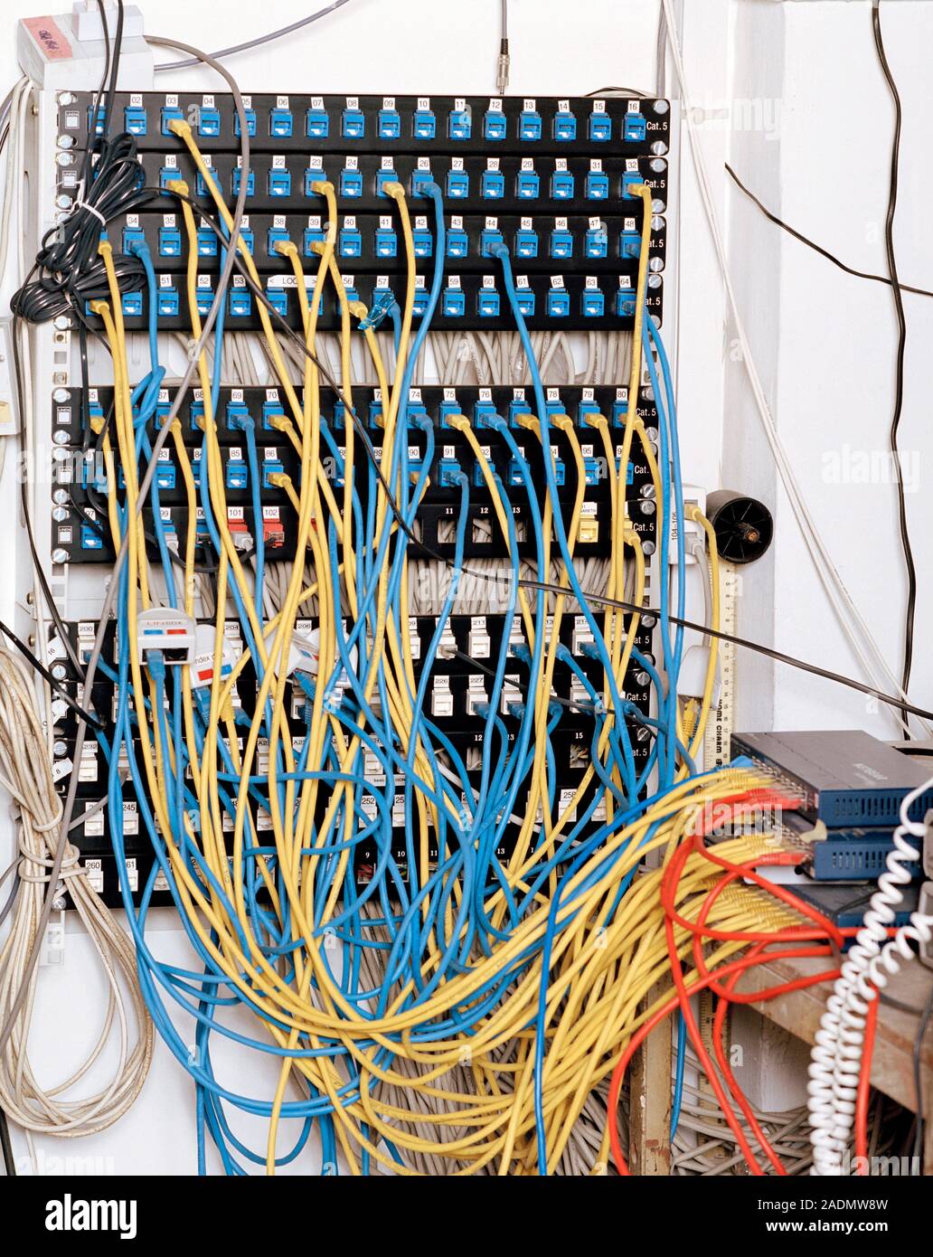 Communications room. Patch panel and wires in an office communications ...