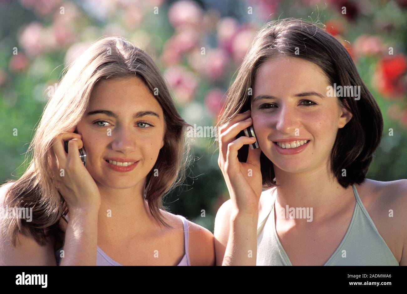MODEL RELEASED. Mobile phone use. Teenage girls on mobile phones Stock ...