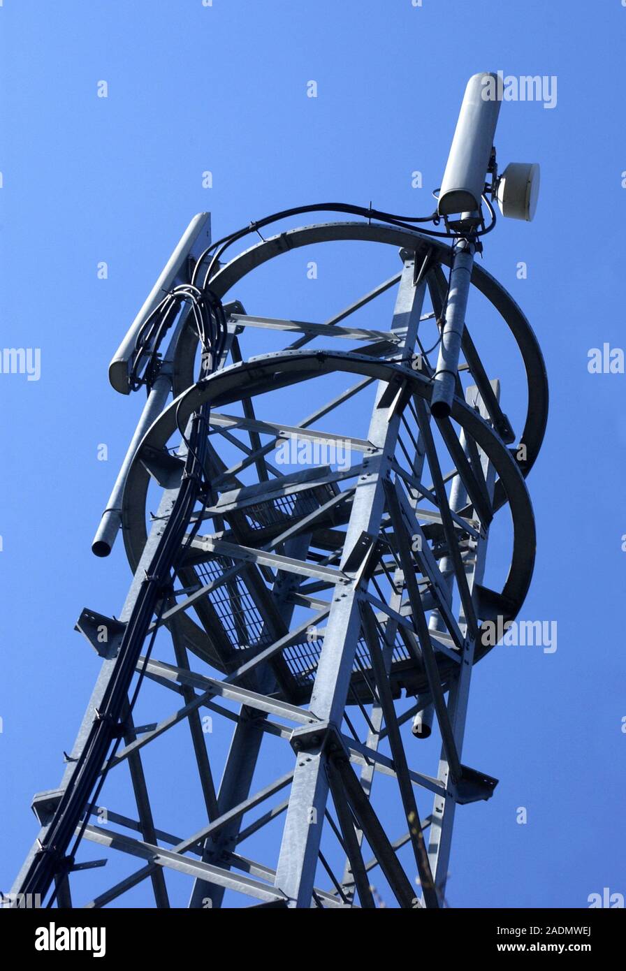 Mobile phone mast. Antennas mounted on top of a mast. The panel-shaped ...