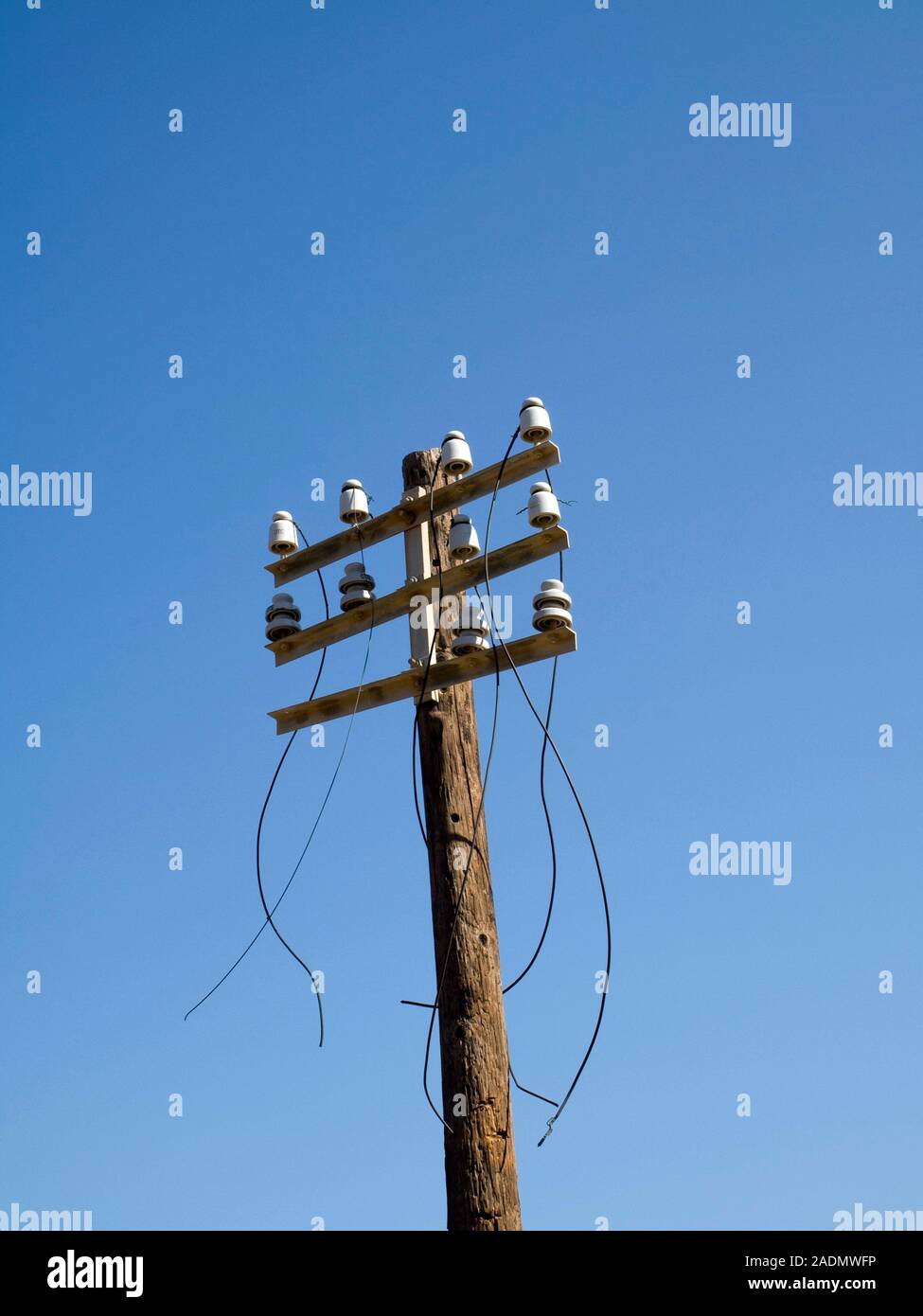 Telephone pole with cut wires Stock Photo - Alamy