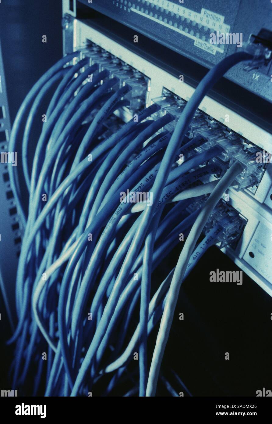 Computer patch panel, or board, connected to many patch leads. Each ...