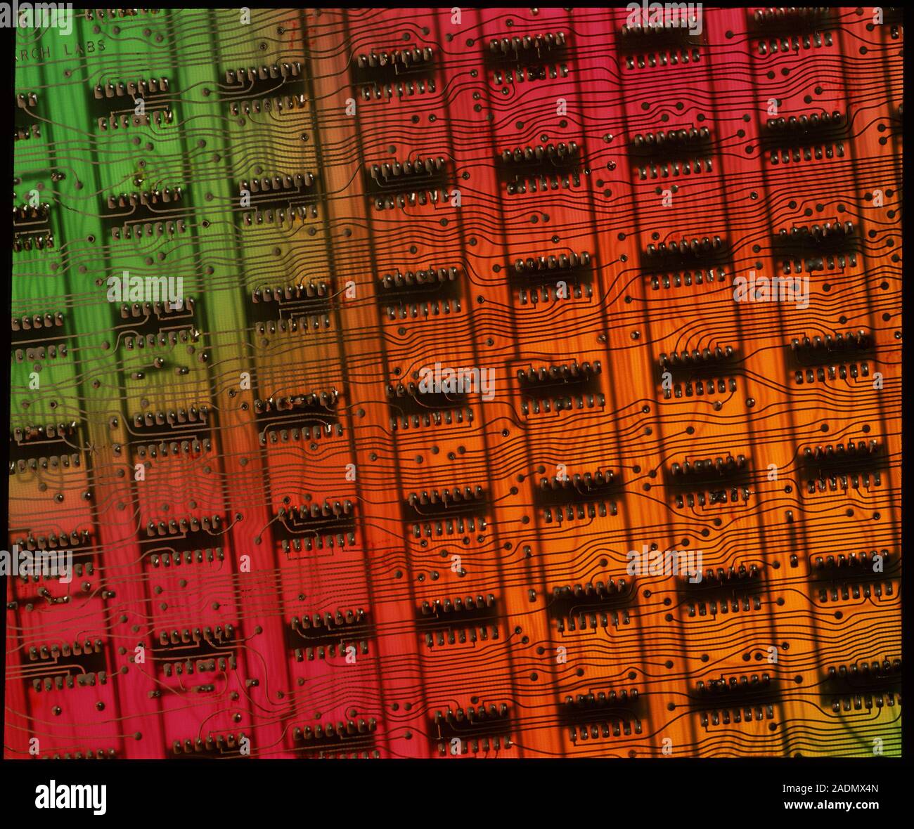Rows of rectangular integrated circuits (chips) on a computer memory ...