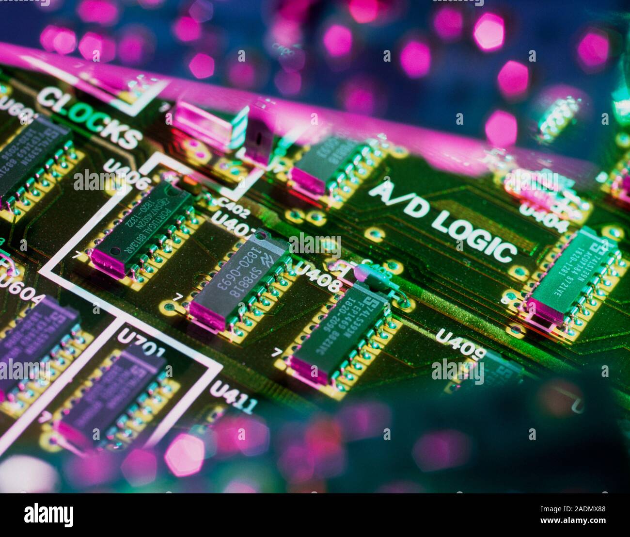 Circuit board. Microchips (black) attached to an electronic circuit ...