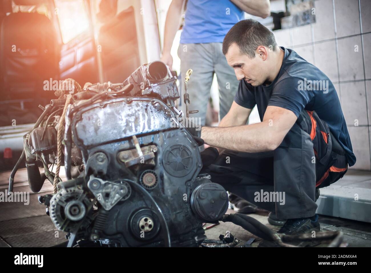 Removed engine from car. Two car master auto mechanic repairer chacking ...