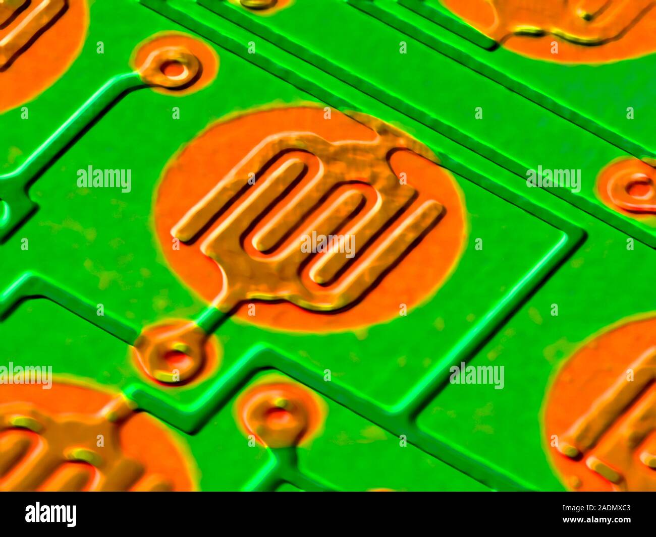 Circuit board. Coloured scanning electron micrograph (SEM) of a ...