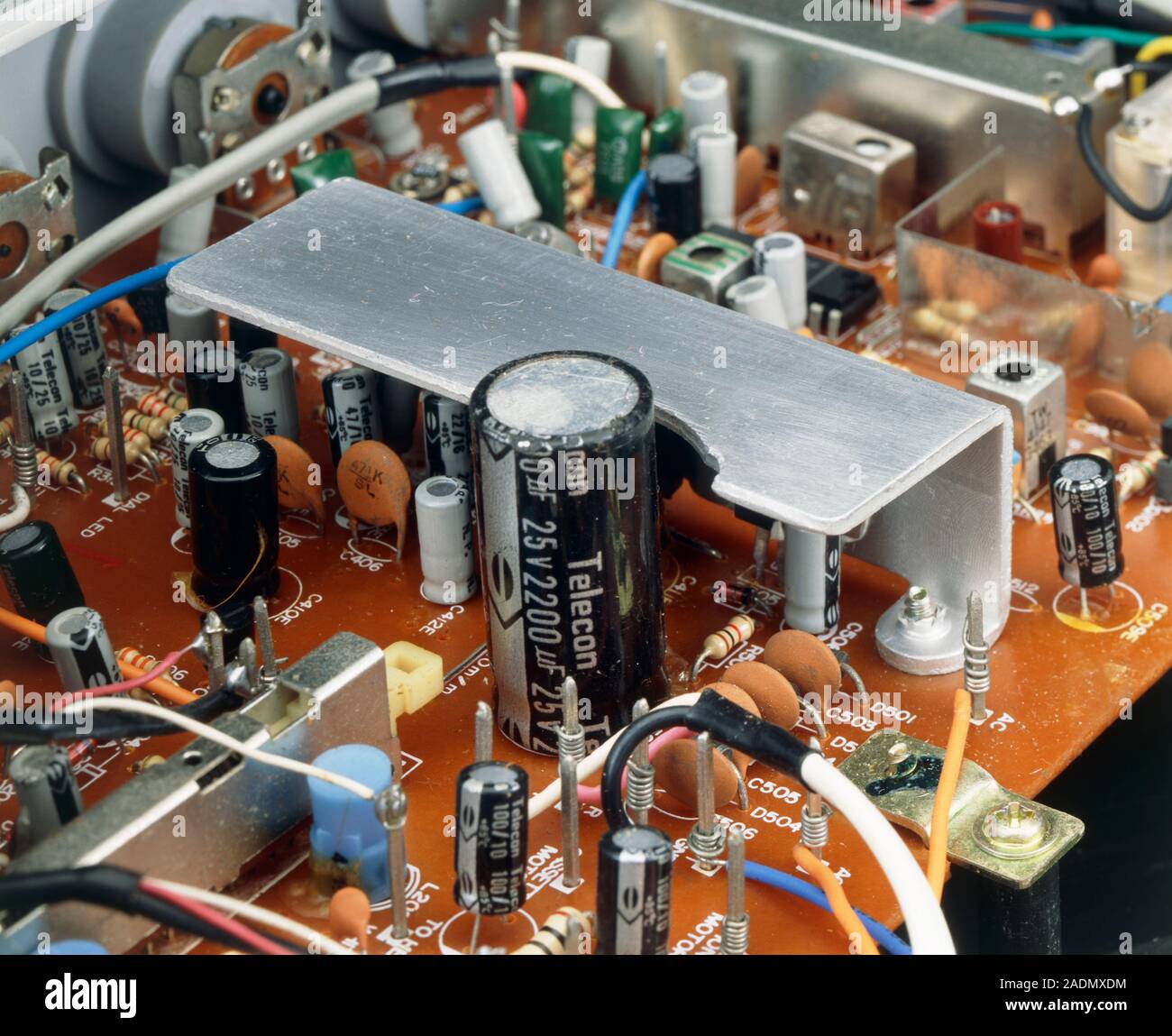 Heat sink plate (metal, centre) on a radio tuner and amplifier circuit ...