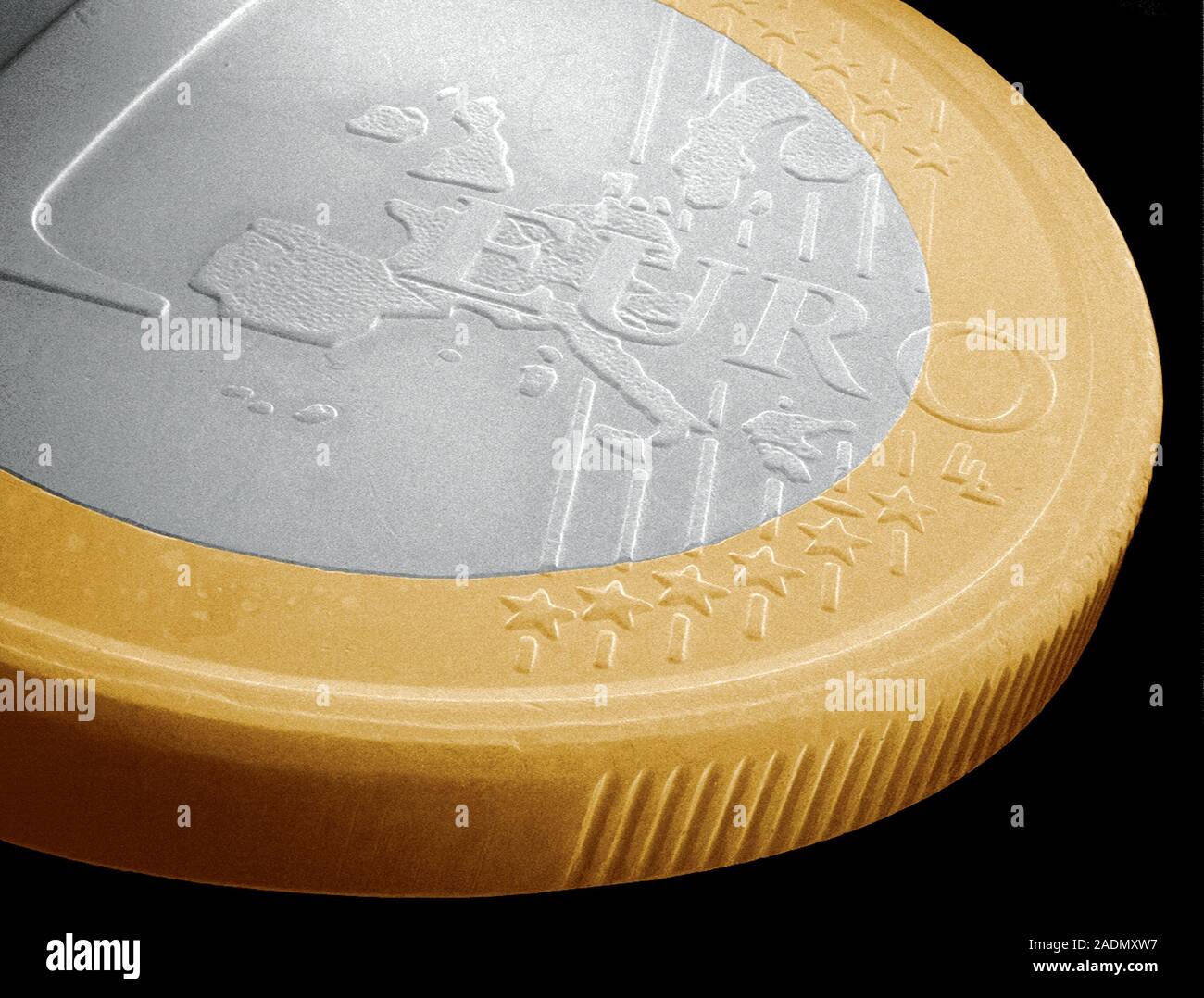 One euro coin, coloured scanning electron micrograph (SEM). Euro coins ...