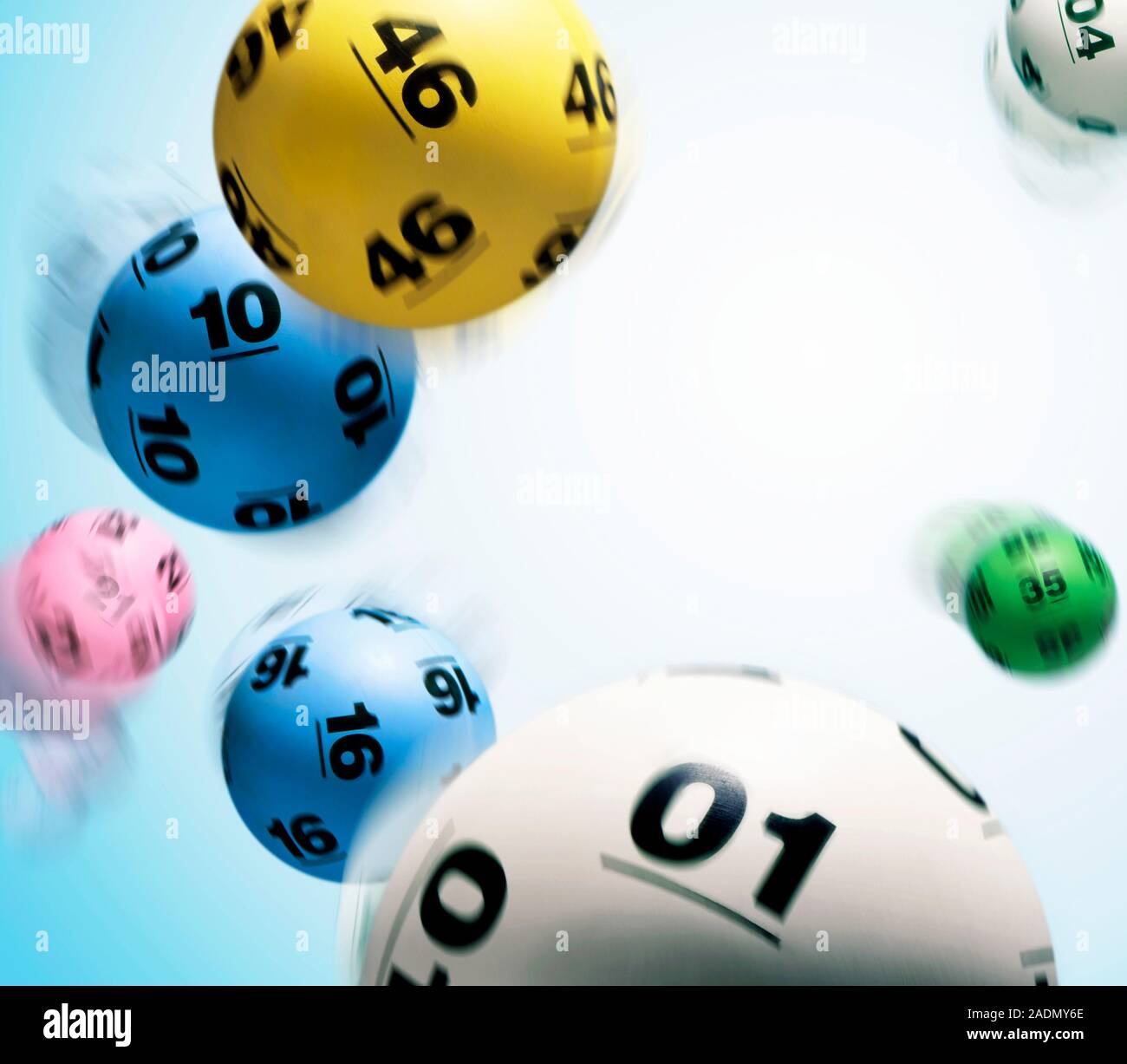 Lottery balls tumbling. The balls are individually numbered between 1 ...