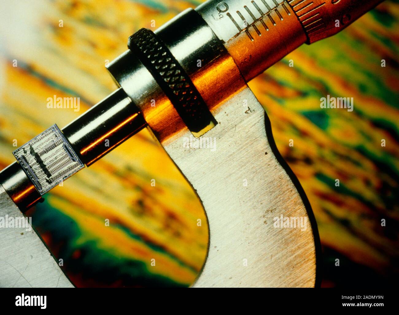 Macrophotograph of a Ferranti Electronics Ltd microprocessor chip held ...