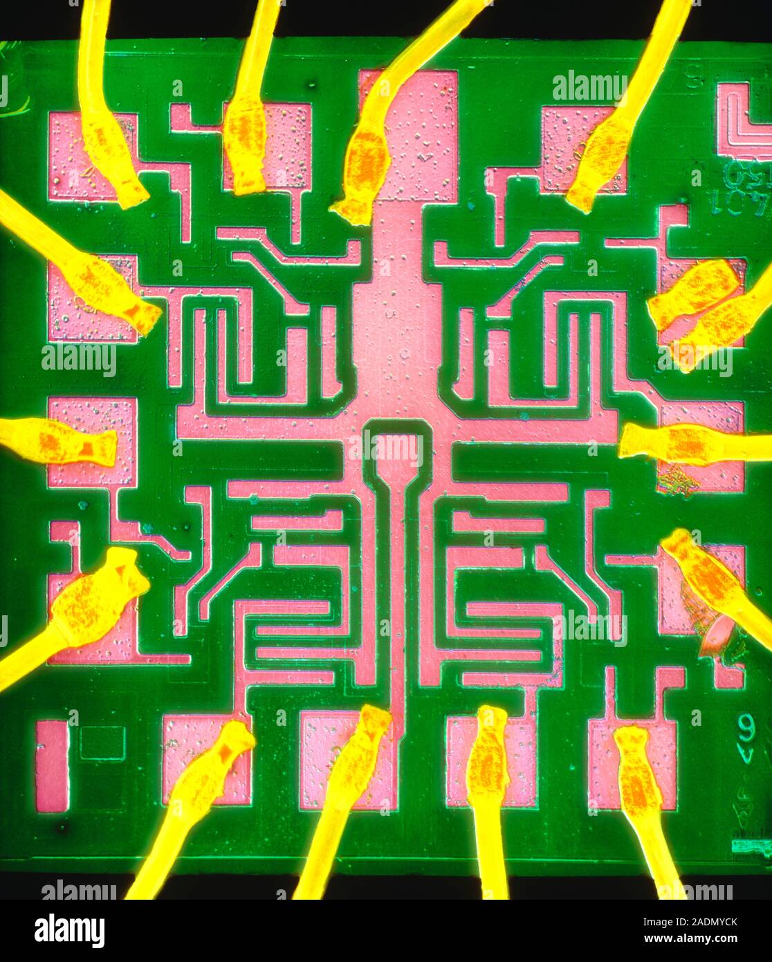 Coloured scanning electron micrograph of the surface of a 7401 TTL ...