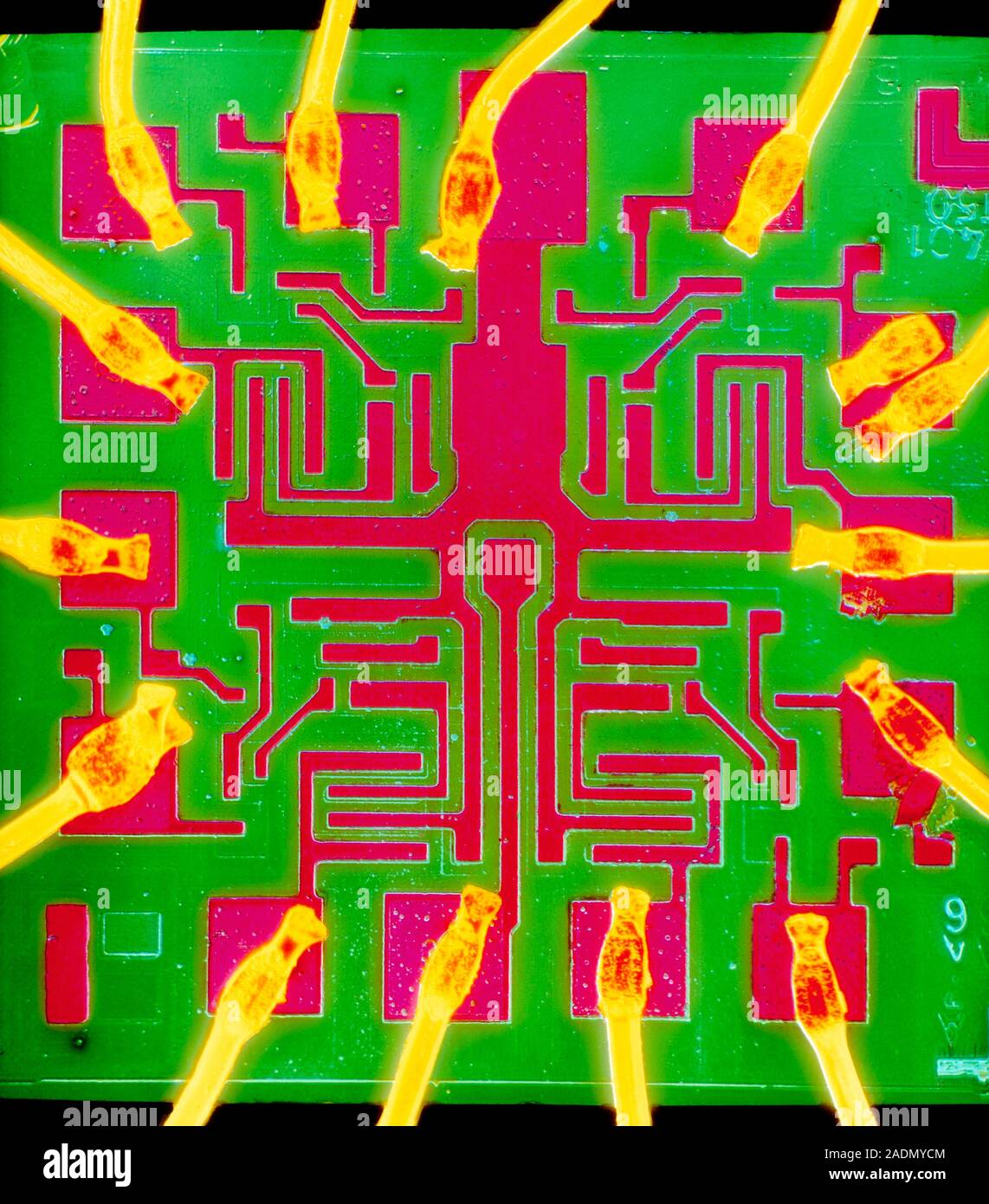 Coloured scanning electron micrograph of the surface of a 7401 TTL ...