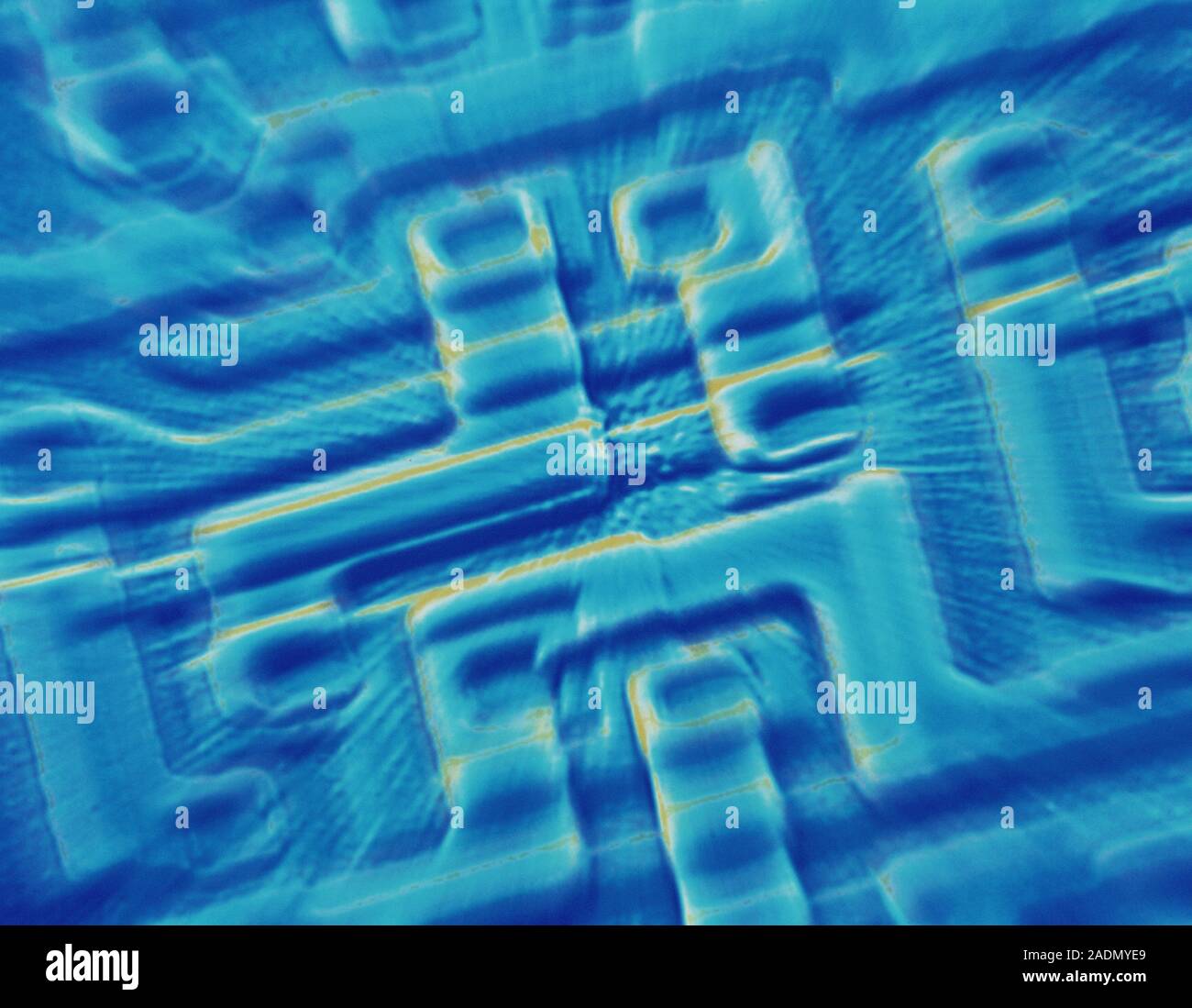 Silicon chip. Coloured Scanning Electron Micro- graph (SEM) of the ...