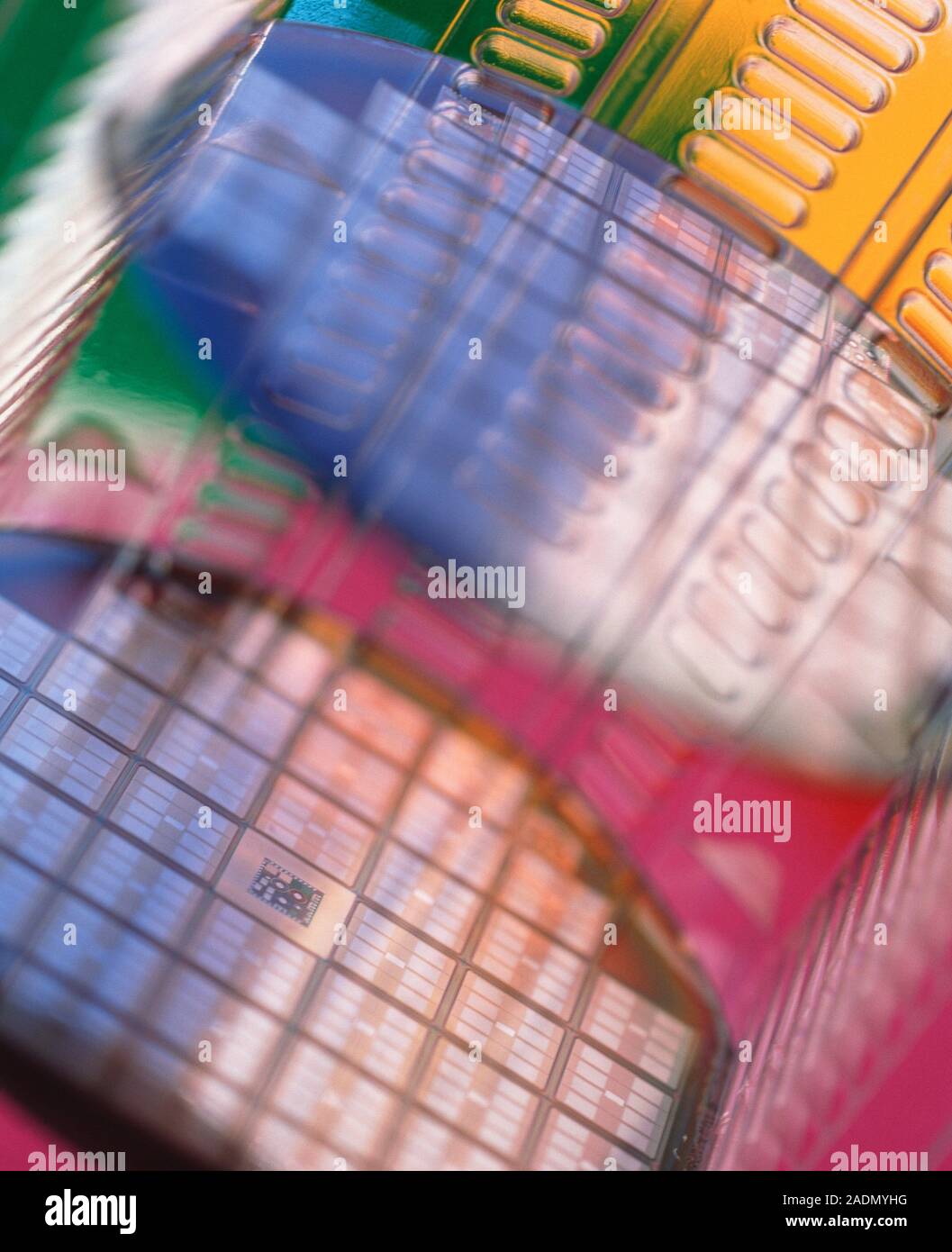 Silicon wafers and chips. View of two processed silicon wafers (upper ...