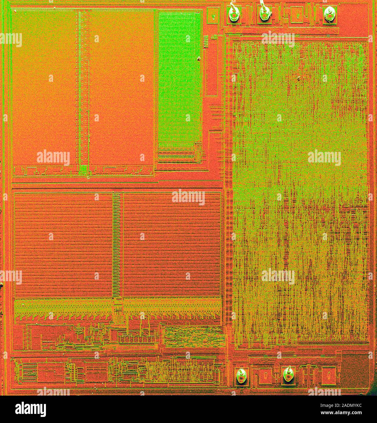 Microchip. Coloured scanning electron micrograph (SEM) of a microchip ... Microchip. Coloured scanning electron micrograph (SEM) of a microchip ...