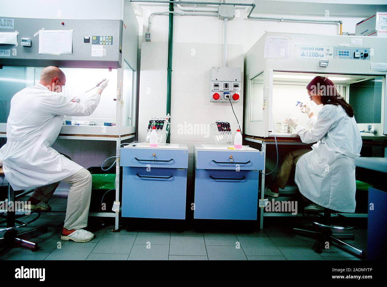 Neurochip research. Researchers working on producing an interface for a ...