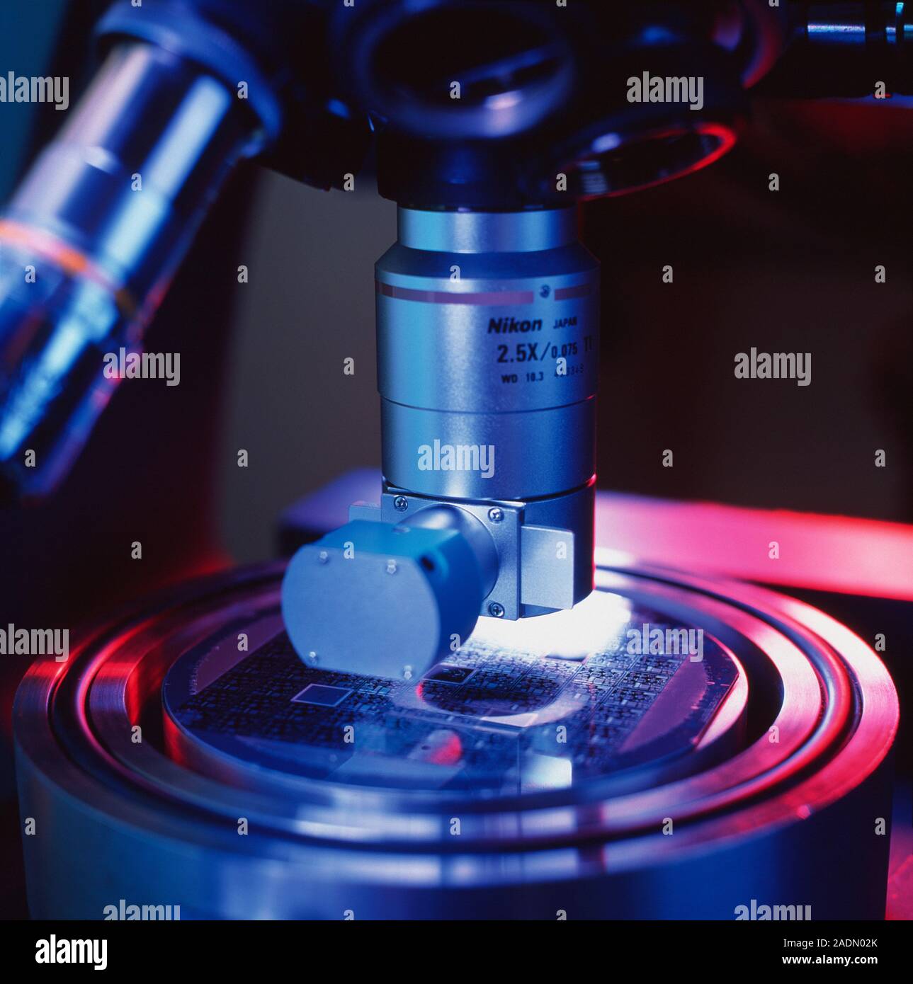 Examining microdevices. Sheet of microelectromech- anical systems (MEMS ...