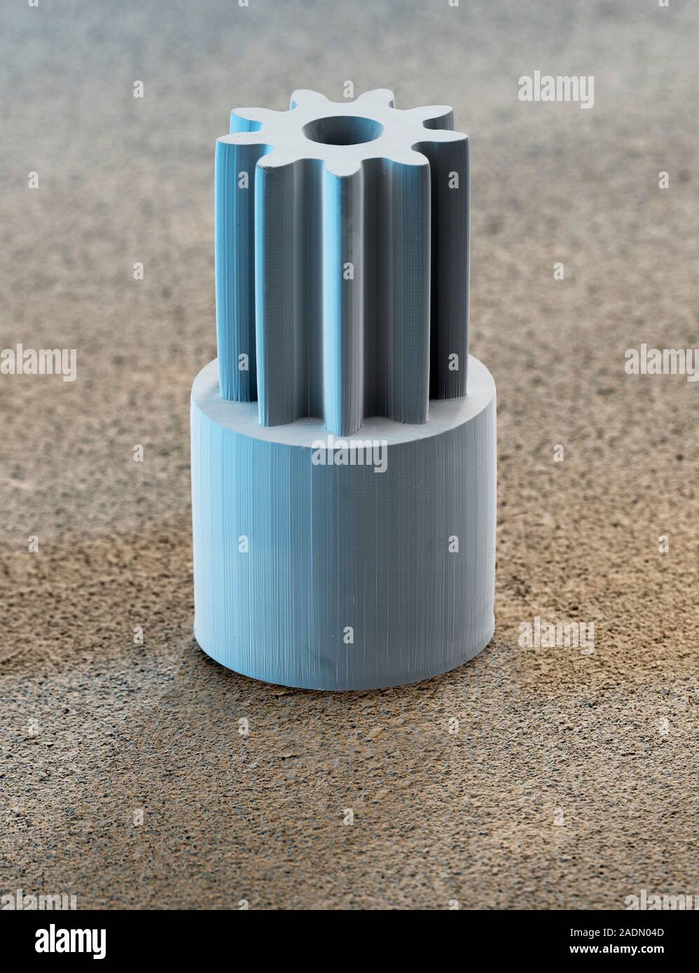 Micromechanical gears. Coloured scanning electron micrograph (SEM) of ...