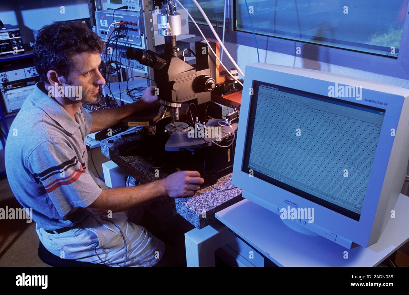 Microdrone technology. Researcher using a microscope (output seen on ...