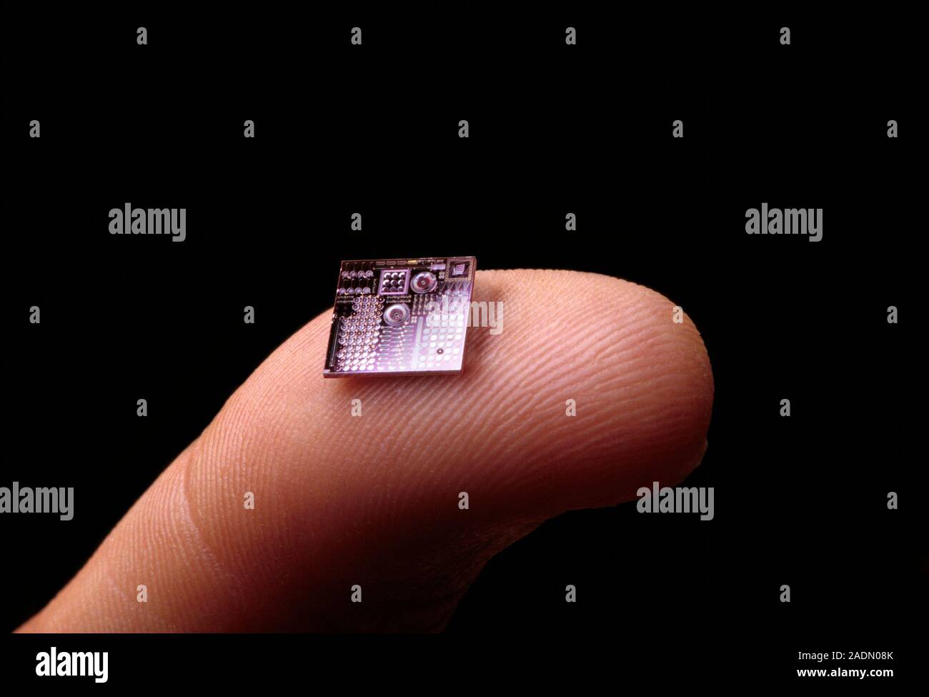 Microelectromechanical device on a finger tip. MEMS ...