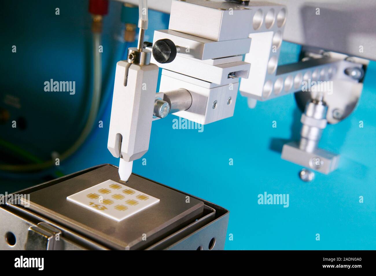 MEMS production. Bonding apparatus being used to mount MEMS ...