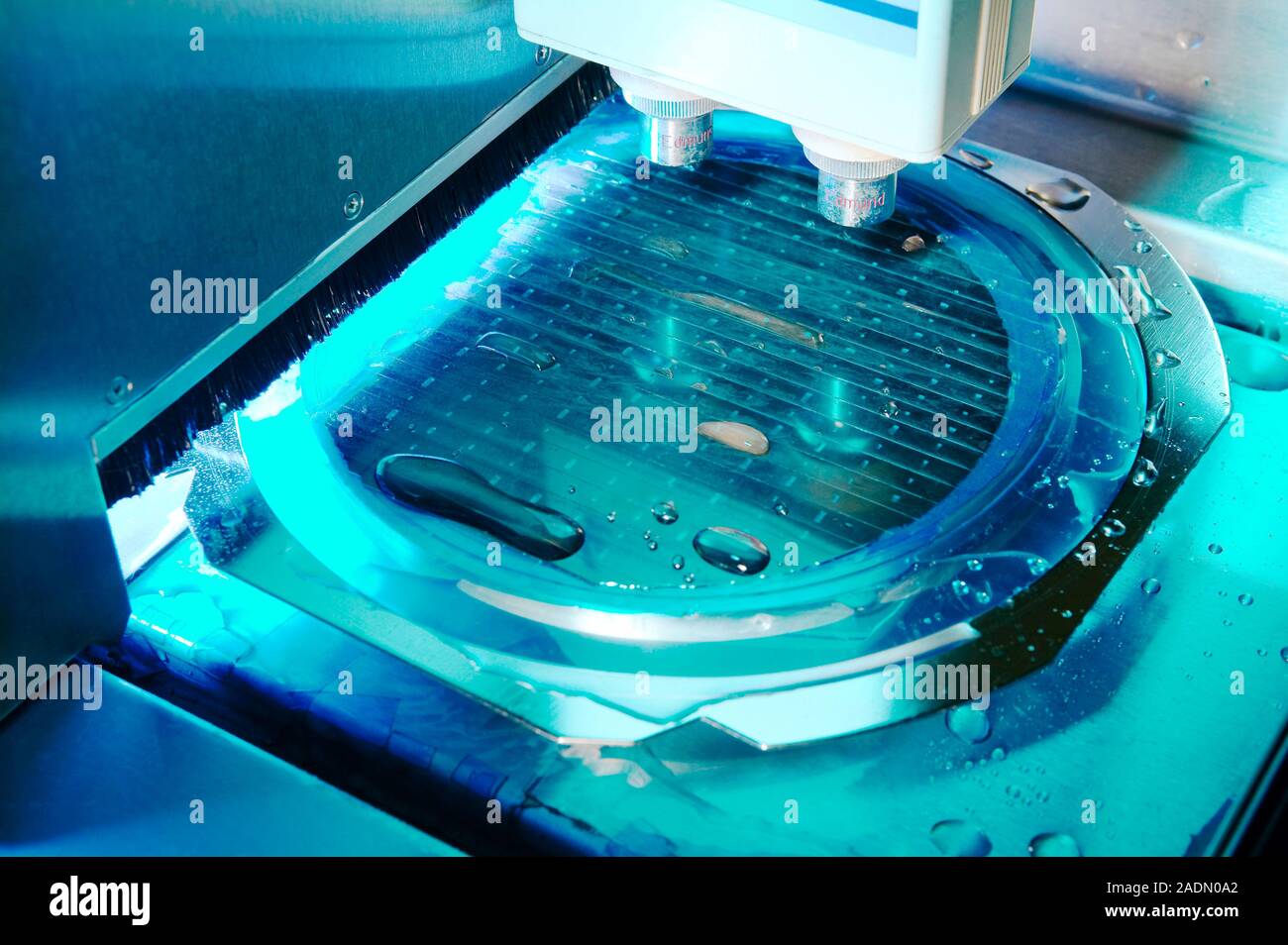 MEMS production. Machine being used to cut up a silicon wafer of MEMS ...