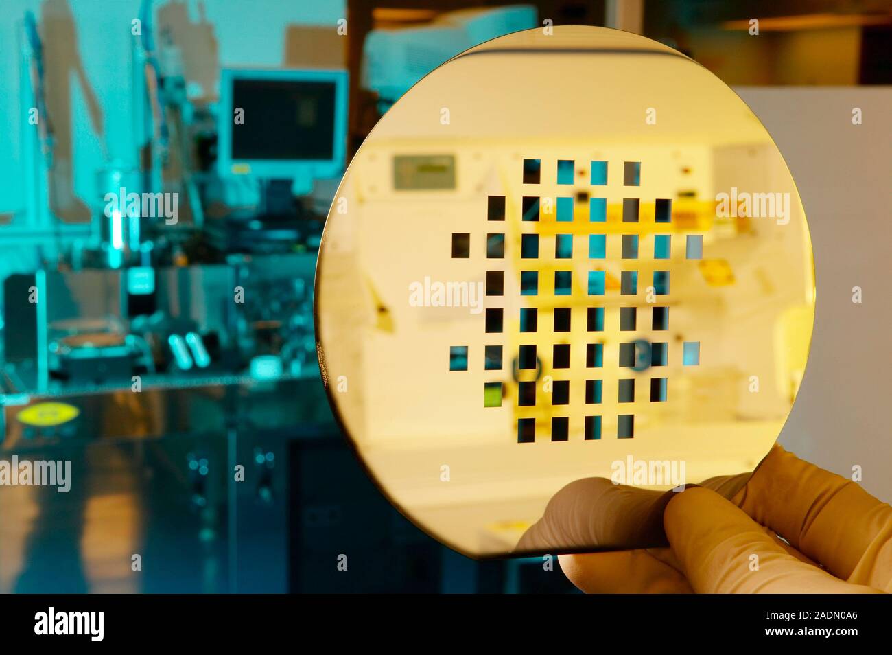 MODEL RELEASED. MEMS production. Machined silicon wafer being used for ...