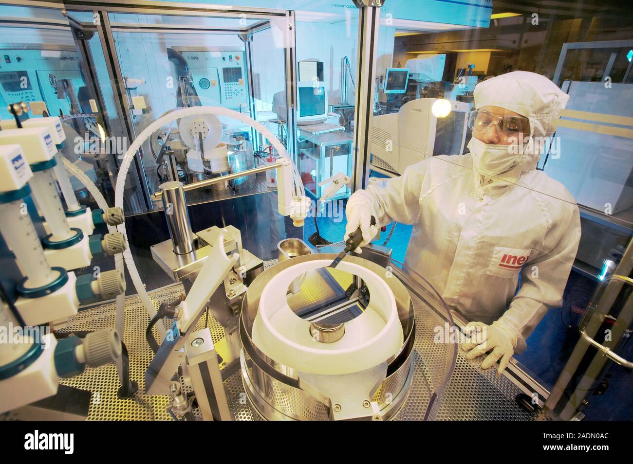 MODEL RELEASED. MEMS production. Clean room technician using ...