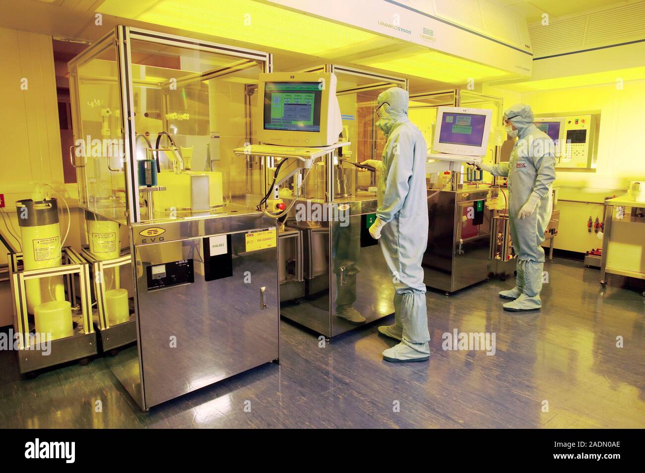 MODEL RELEASED. MEMS production. Clean room technicians using ...