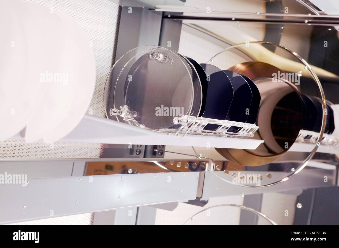 MEMS production. Row of silicon wafers entering a furnace during the ...