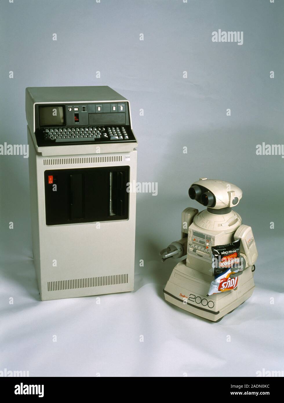 IBM 5110 and Omnibot 2000 robot, holding a packet of crisps, on display ...