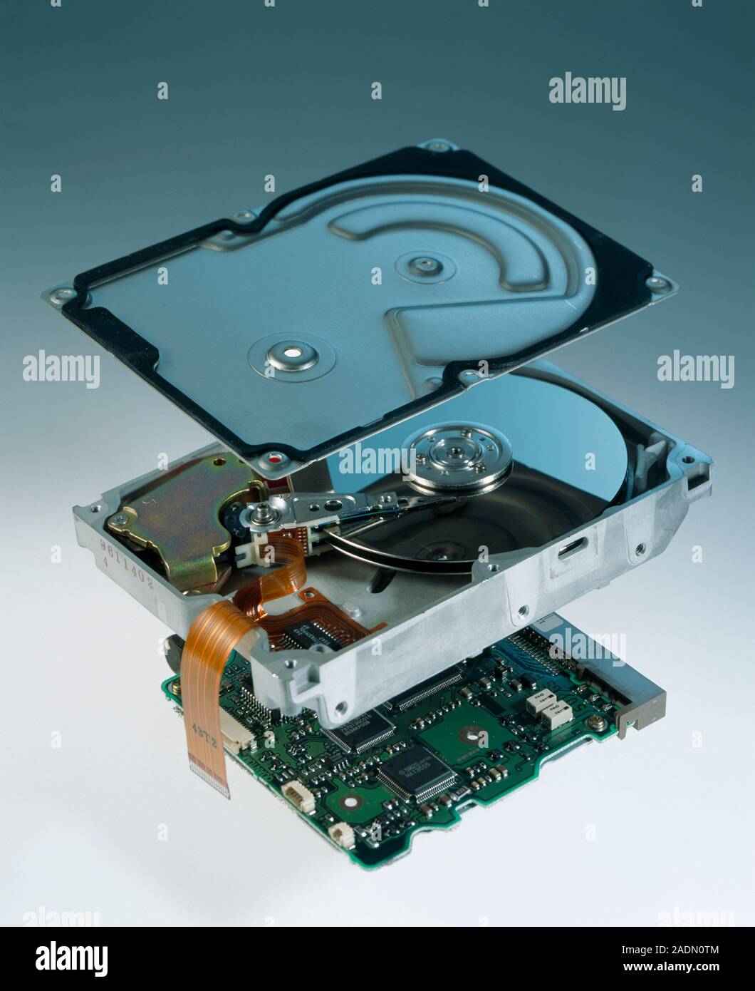 Computer hard disk assembly. Component parts of a hard disk showing the ...
