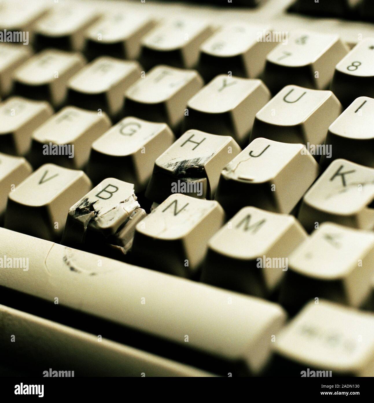 Smashed keyboard. Close-up of broken keys on the keyboard of a computer ...
