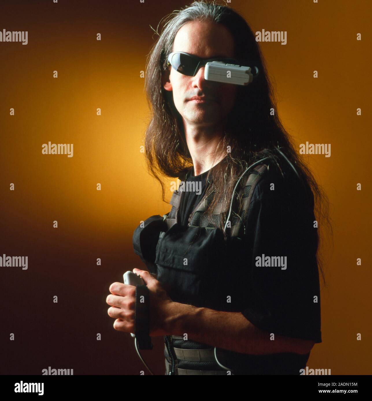 Wearable computing. Researcher wearing devices that are linked to a ...