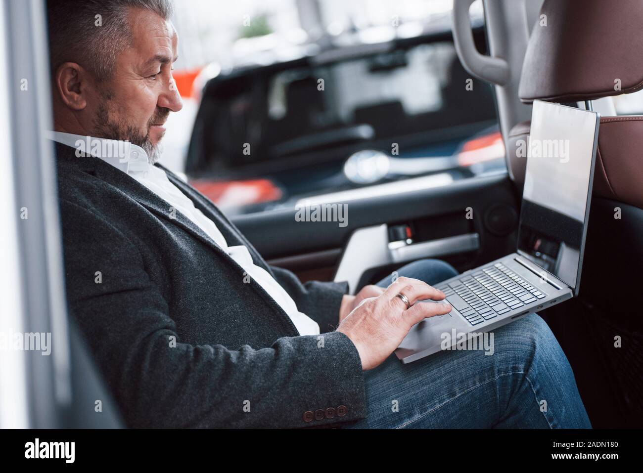 Using computer at side of road hi-res stock photography and images - Alamy