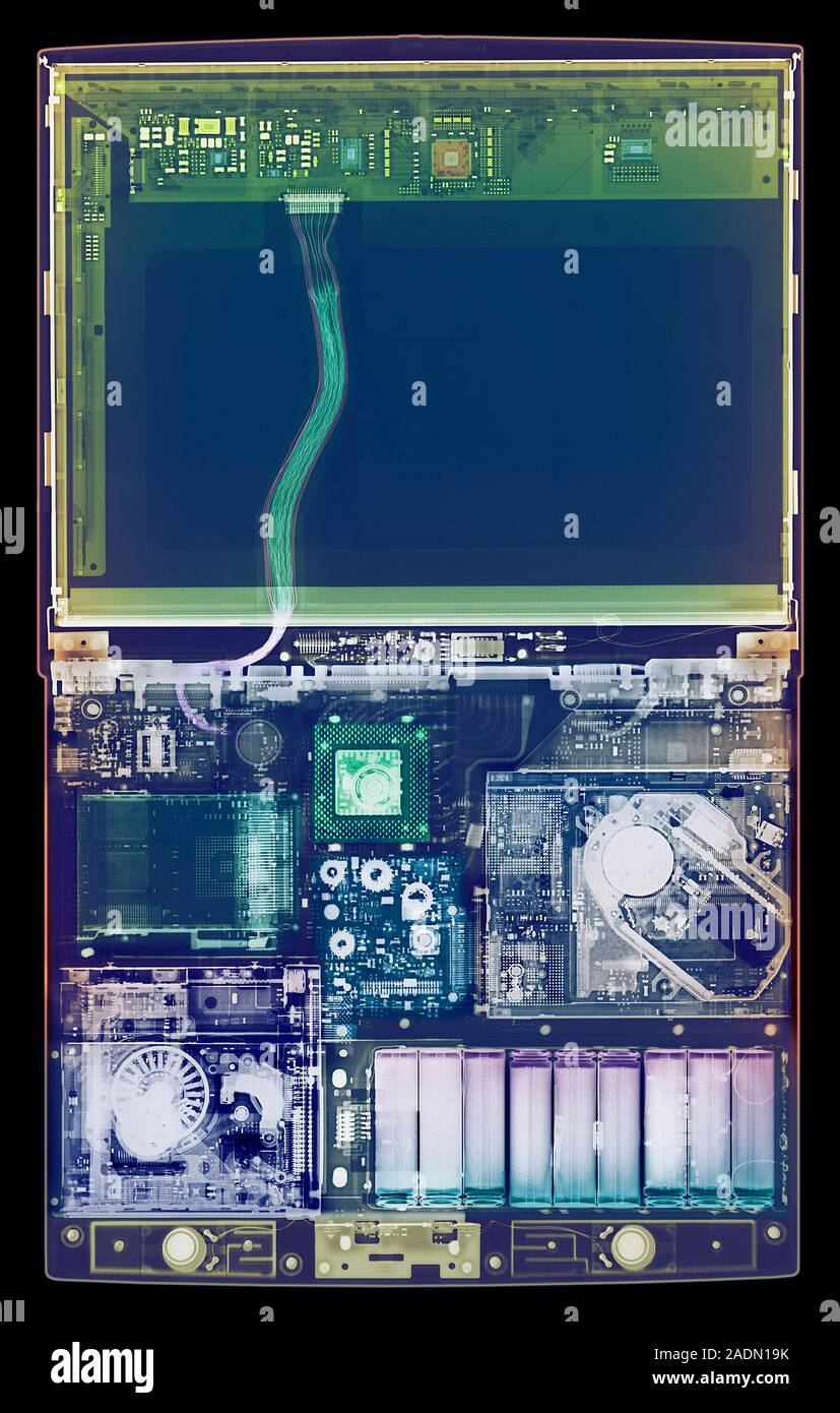 Laptop computer. Coloured X-ray of a laptop computer. The computer's ...