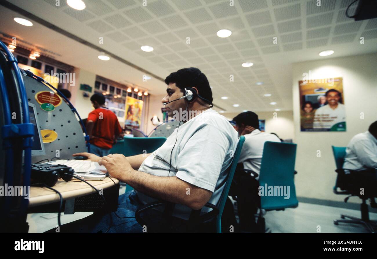 Internet cafe. Customers using computer terminals to 'surf' the ...