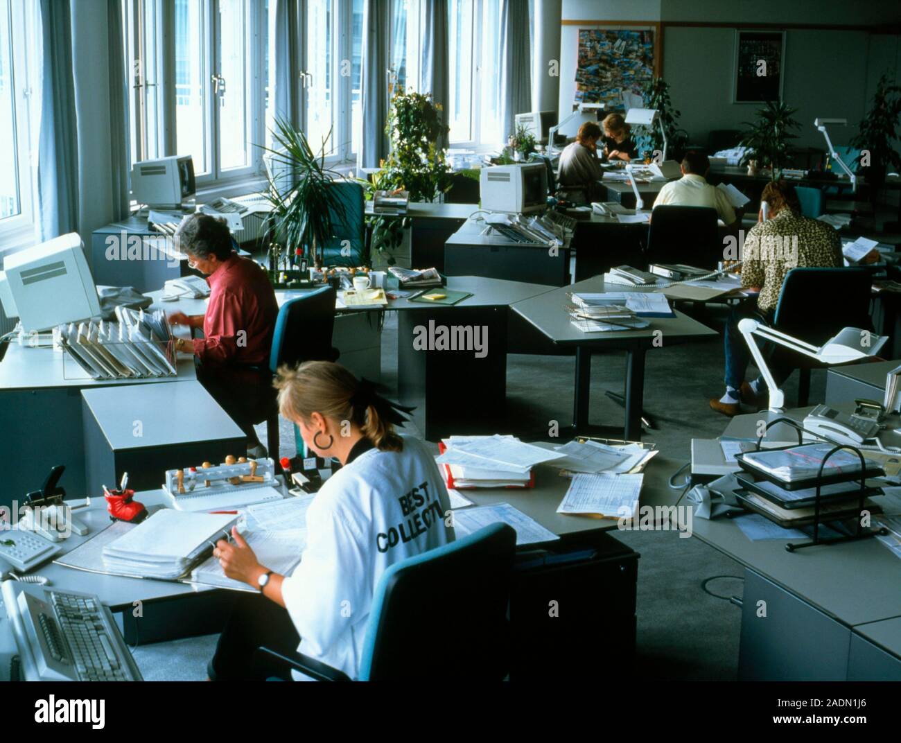 Office computers. View of office workers using computers in an open ...