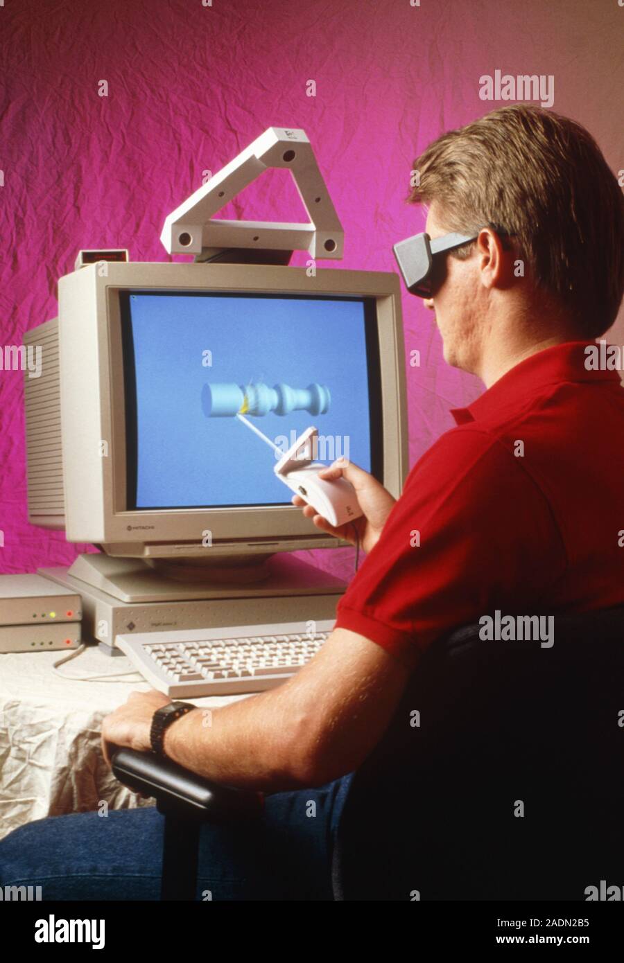 Computer-aided engineering. Technician using a computer-aided design ...