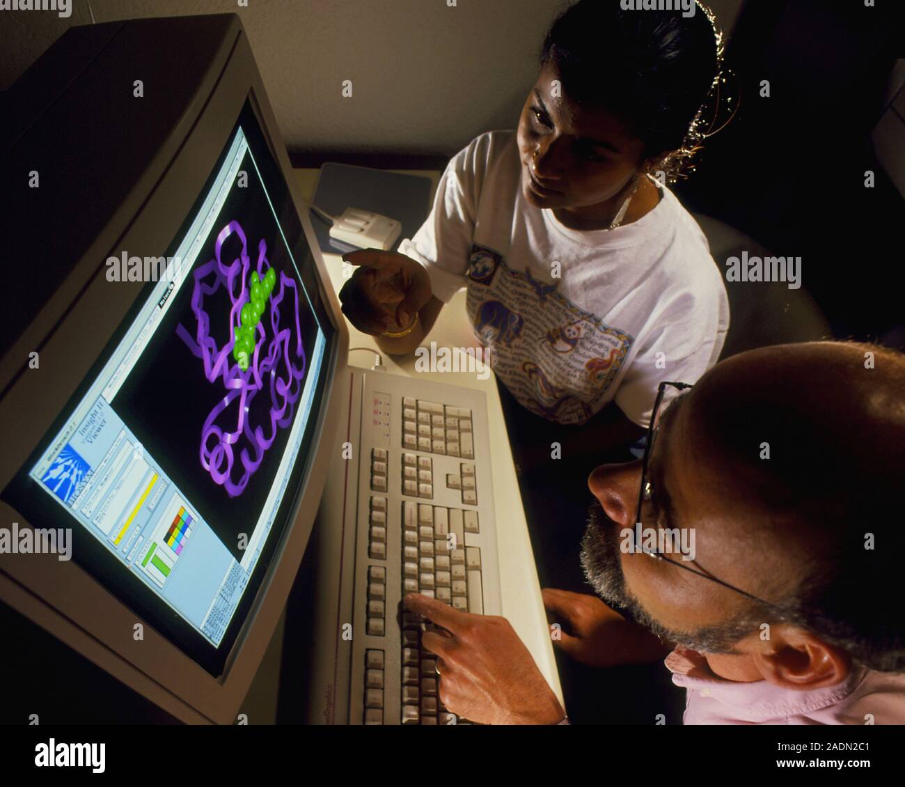 MODEL RELEASED: Molecular modelling. Researchers studying a computer ...