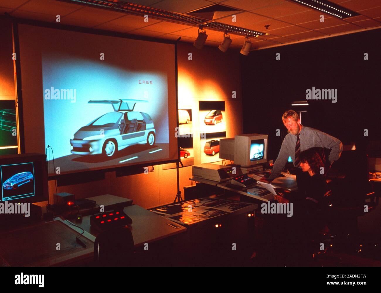 Car design. Computer-aided design (CAD) of a car which is displayed on ...